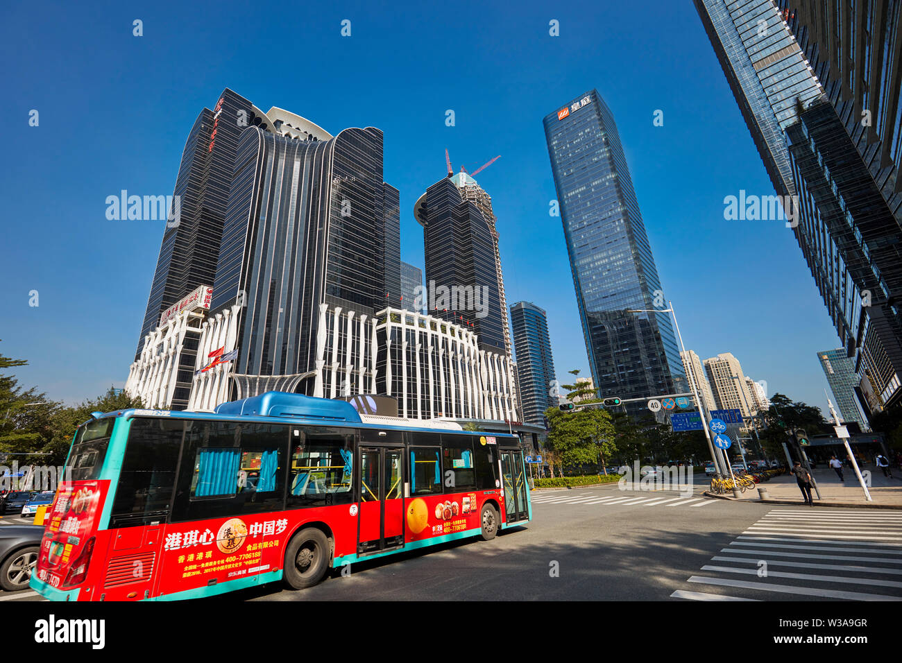 Electric city bus in Futian Central Business District (CBD). Shenzhen ...