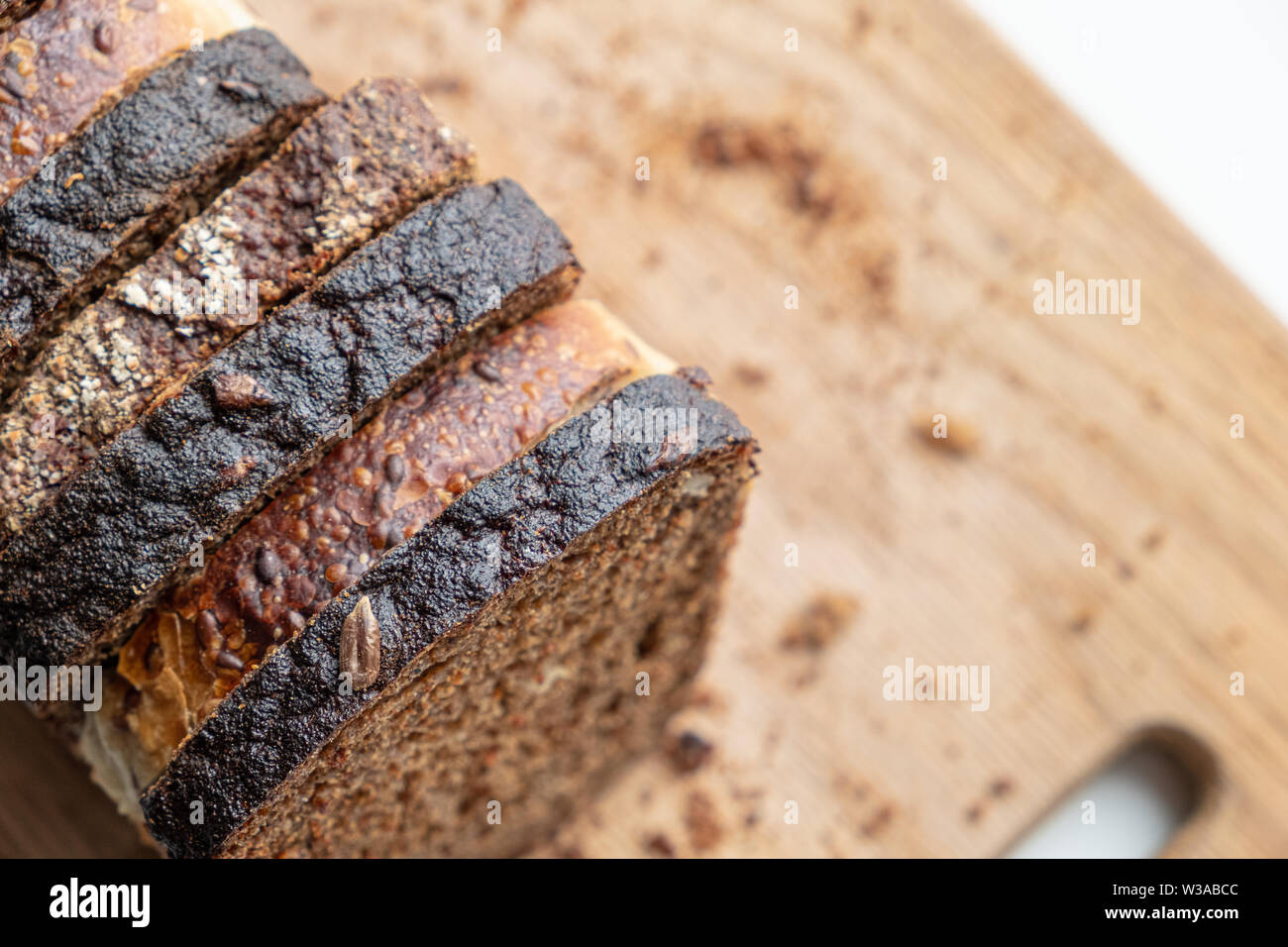 Slices of whole-grain bread, top view. Pieces of wholemeal bread on a ...