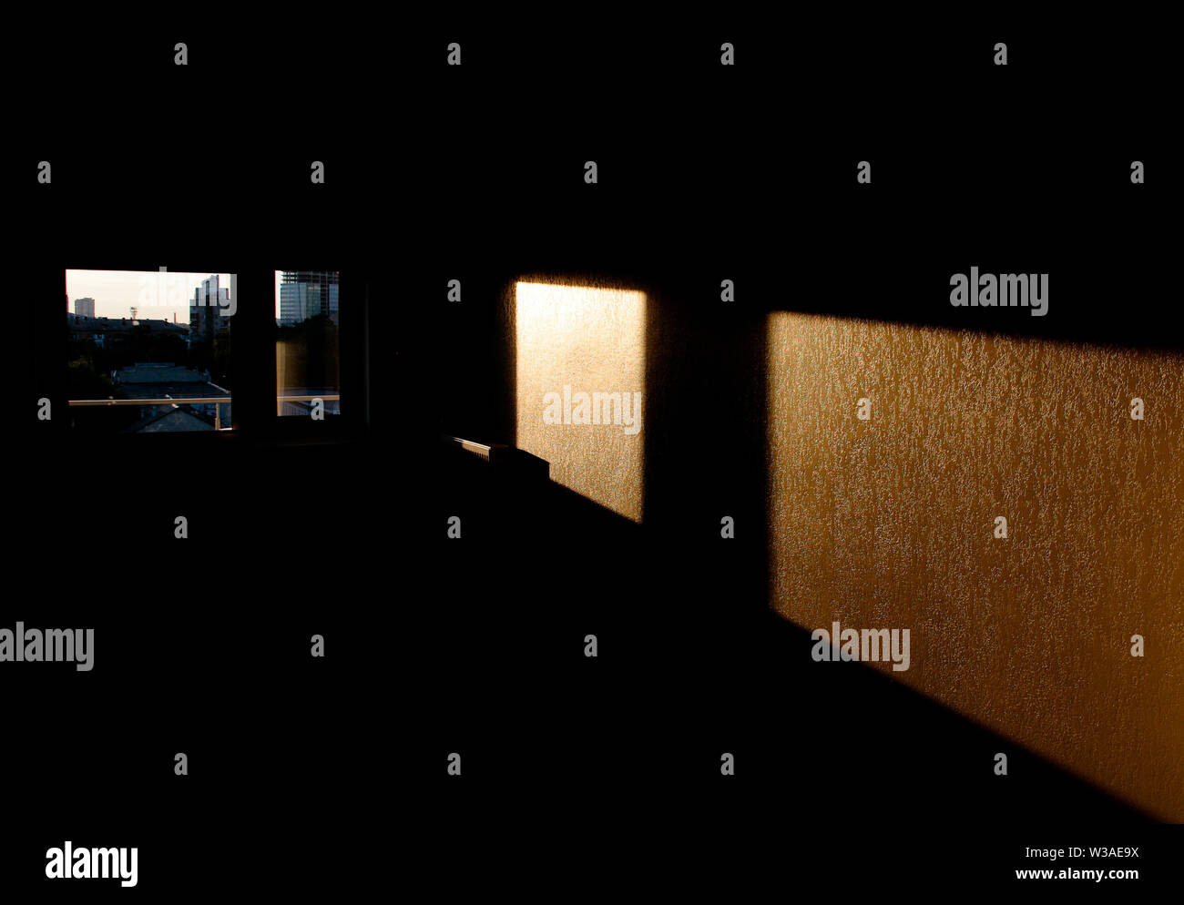 Sunlight falling onto an interior wall from a window Stock Photo - Alamy
