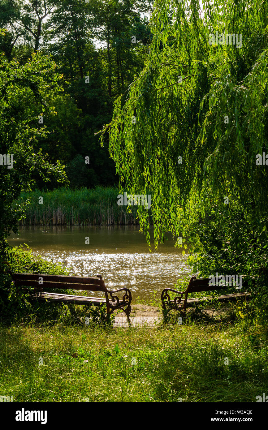 Female male park benches hi-res stock photography and images - Alamy