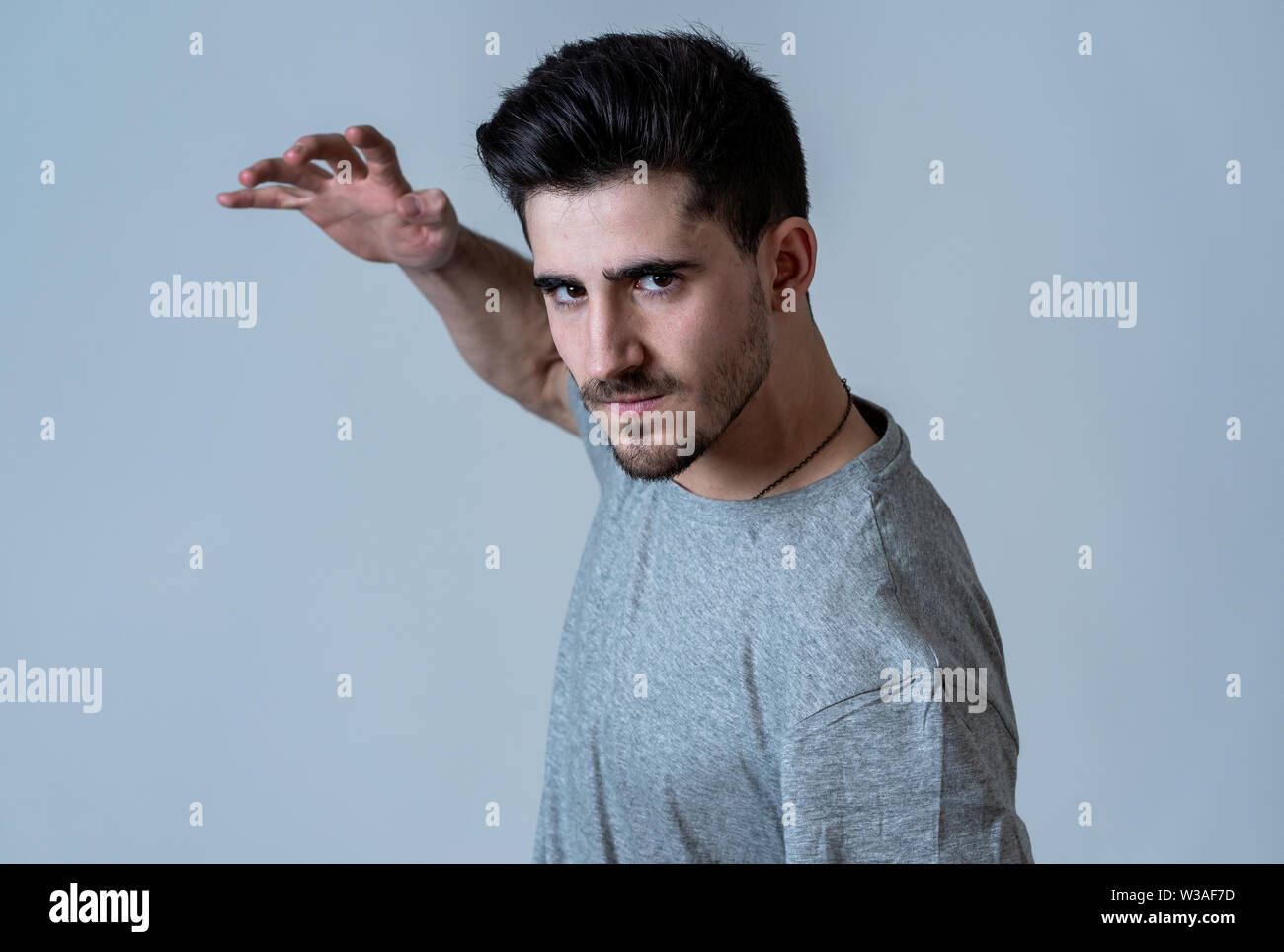 Close up portrait of young violent man with angry face looking furious ...
