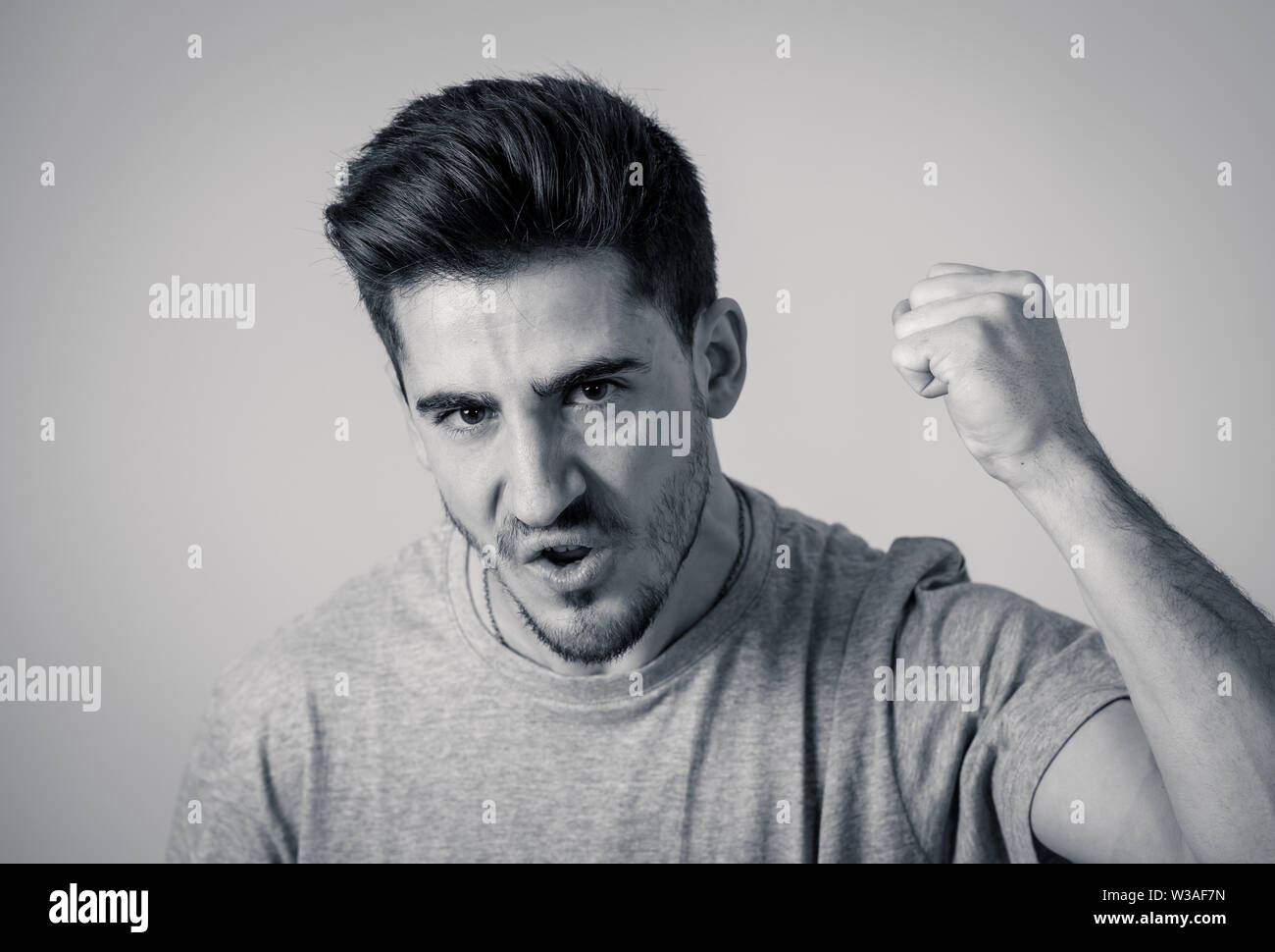 Close up portrait of young violent man with angry face looking furious ...