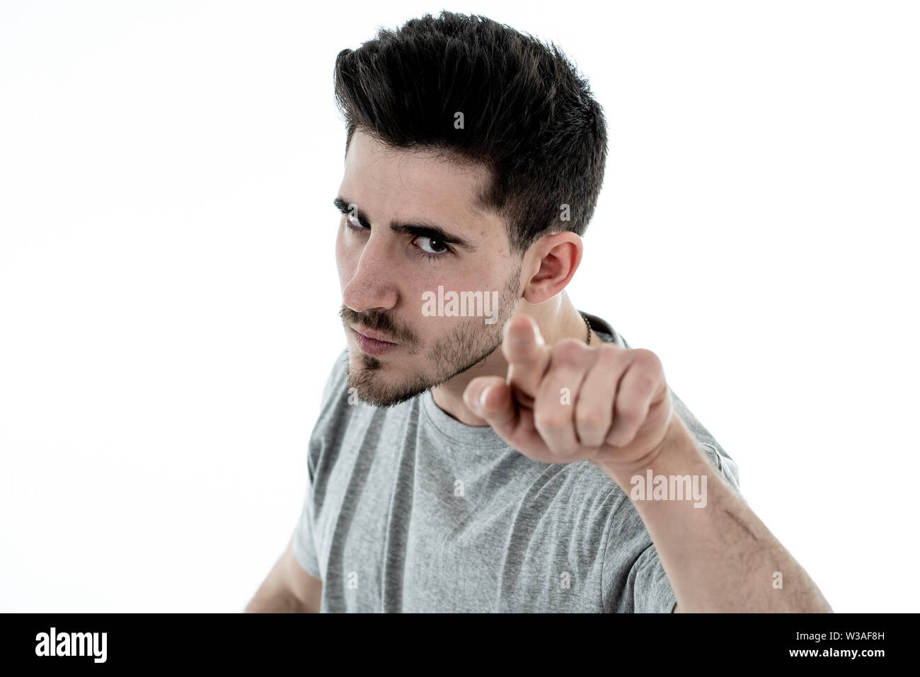 Close up portrait of young violent man with angry face looking furious ...