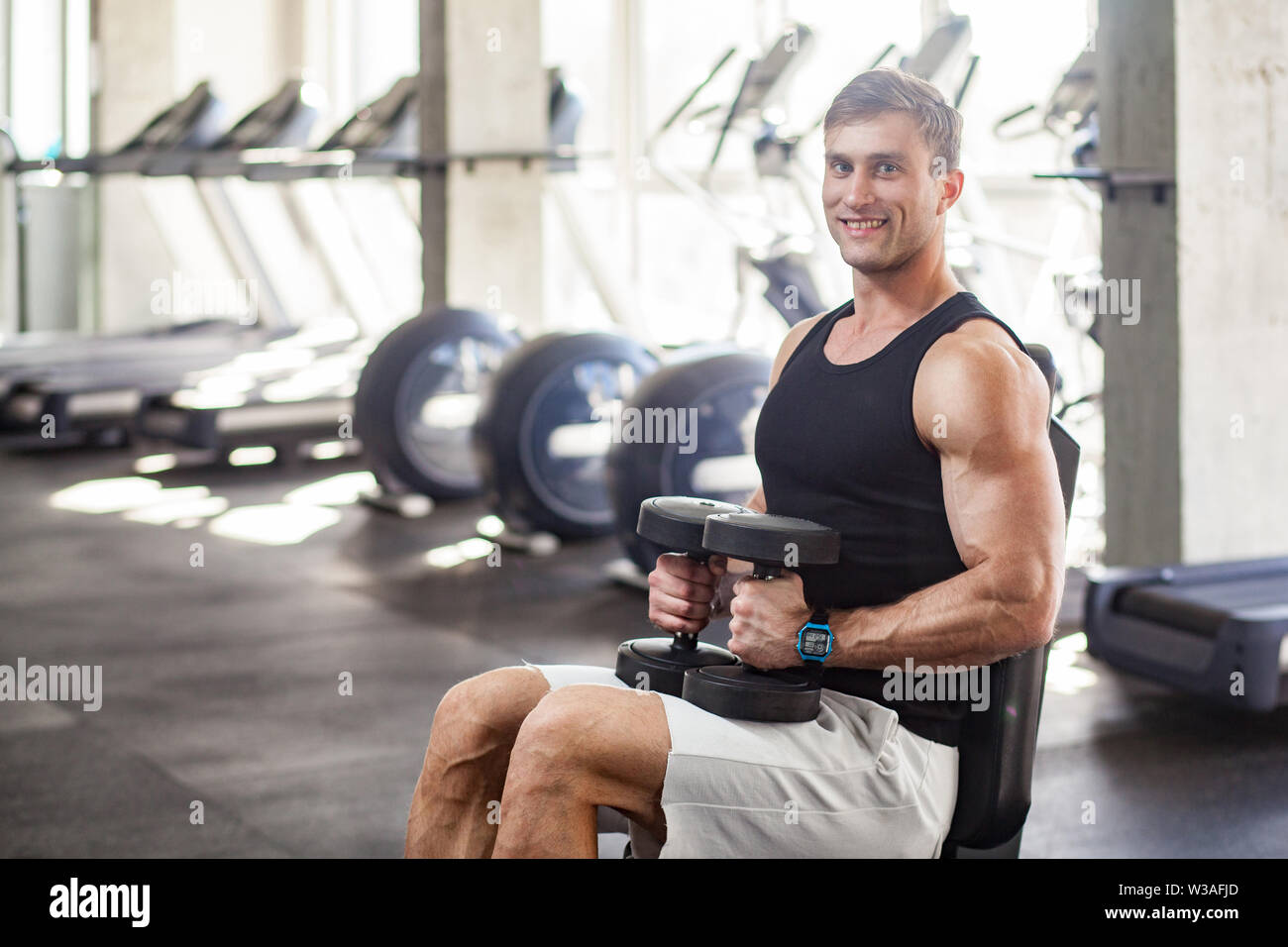 Side view portrait of young adult man muscular built handsome athlete ...