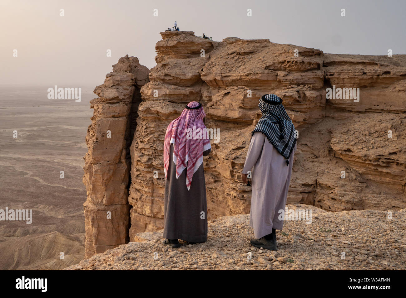 Two men in traditional clothing at the Edge of the World near Riyadh in ...