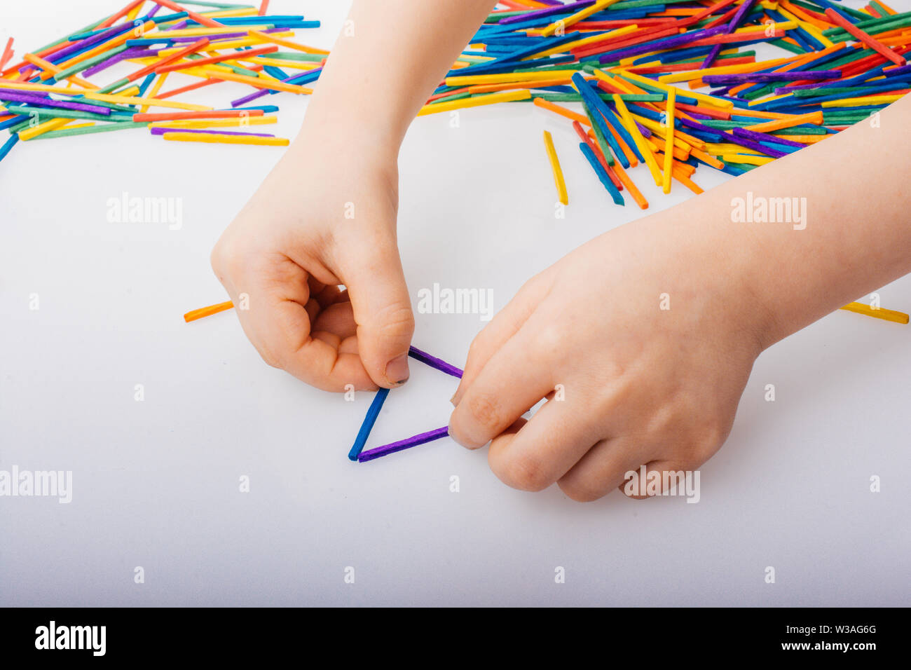 Kid making triangle shape on as creative concept Stock Photo - Alamy