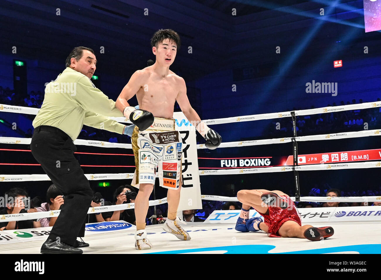 Ken Shiro of Japan knocks down Jonathan Taconing of Philippines during ...