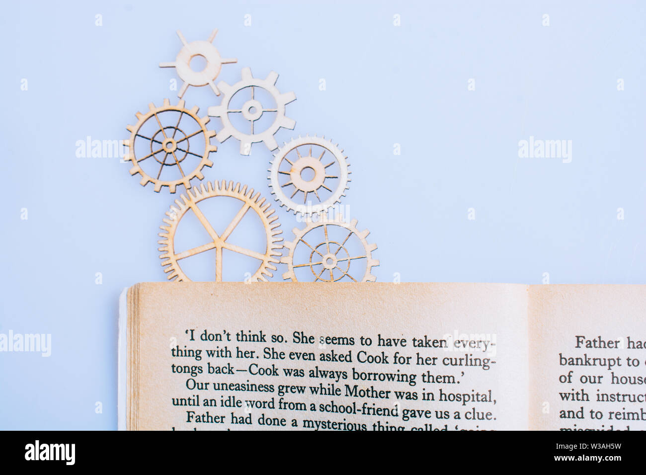 The concept of business gear wheels placed on book page Stock Photo - Alamy