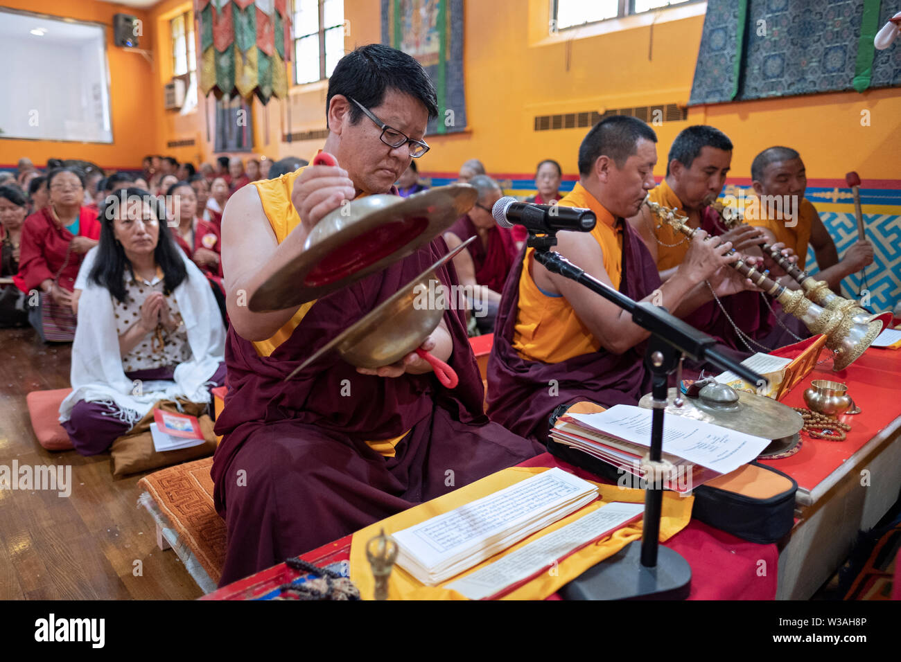 Nepalese Buddhist monks play traditional instruments during a prayer ...