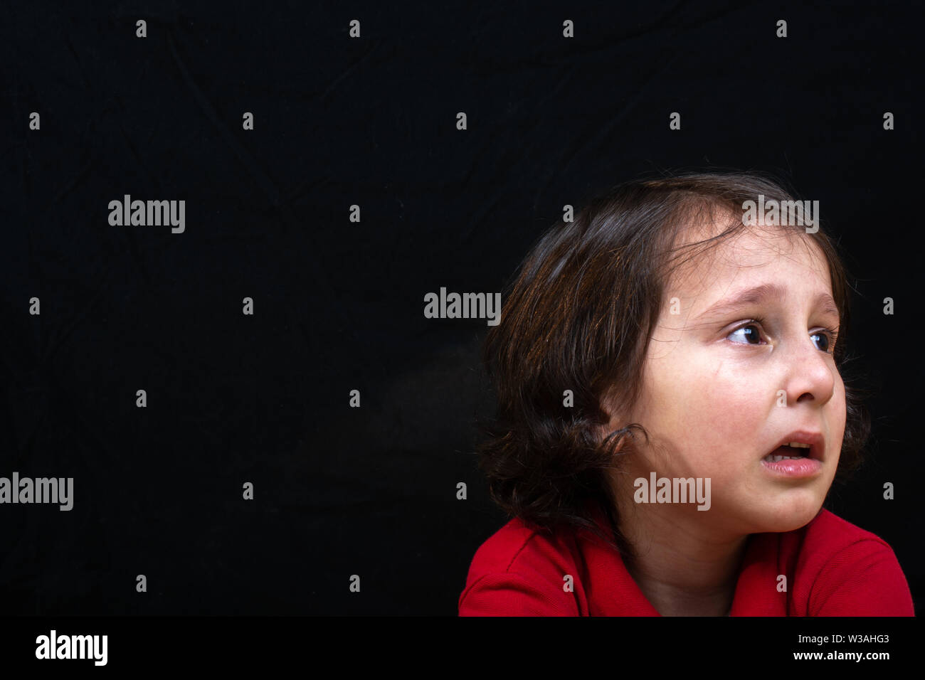 View of a crying boy studio shot Stock Photo - Alamy