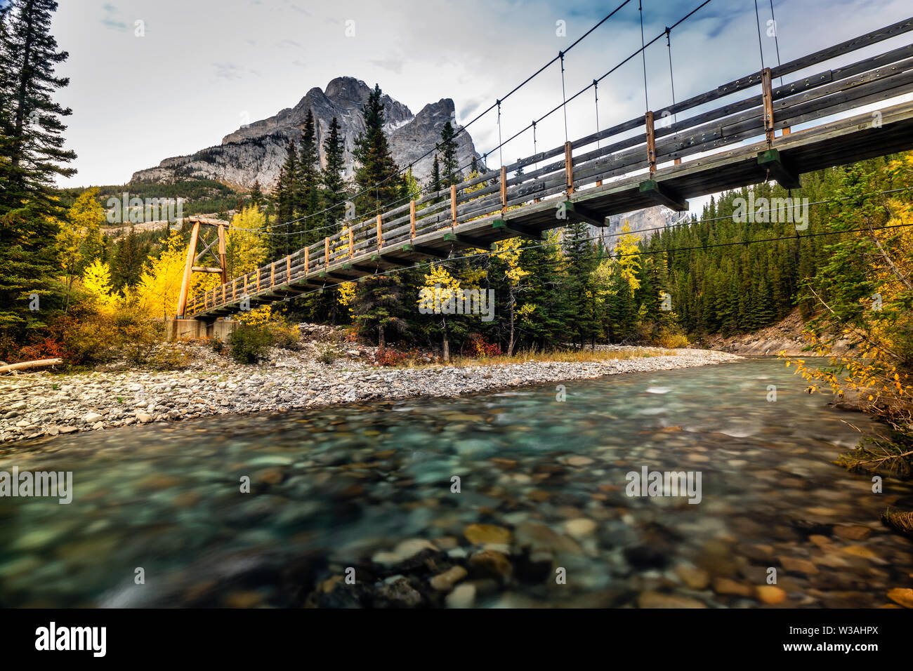 Bridge over river near Canmore, Banff National Park, Canada Stock Photo ...