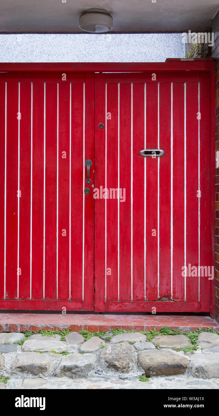 Red wooden panel double doors with mail slot Stock Photo - Alamy
