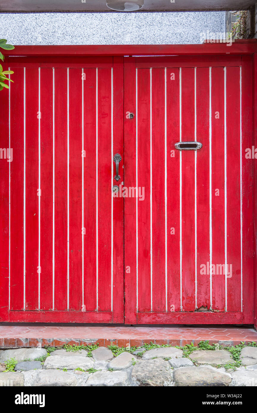 Red wooden panel double doors with mail slot Stock Photo - Alamy