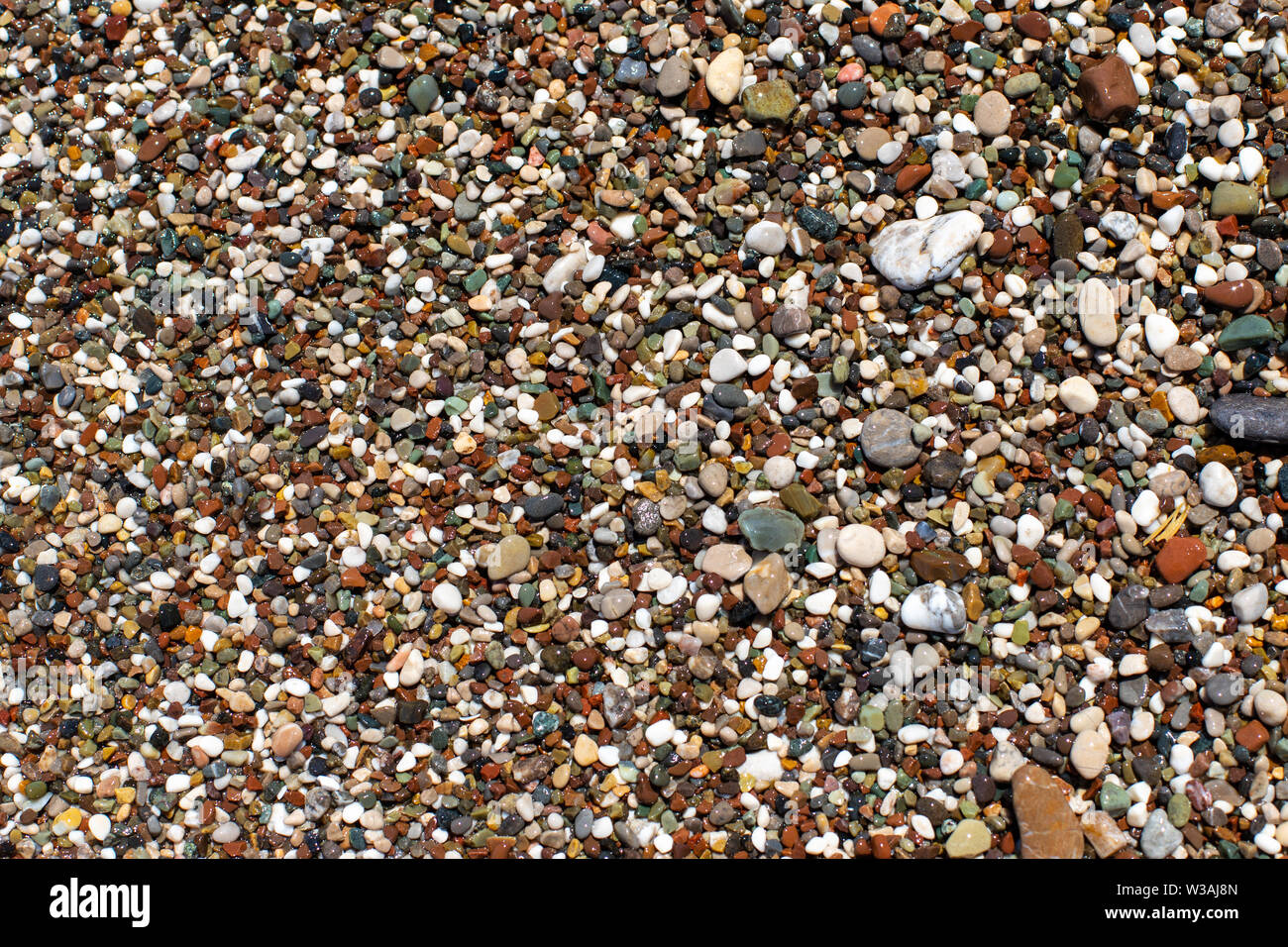 The texture of the beach with coarse sand. The texture of the pebble ...