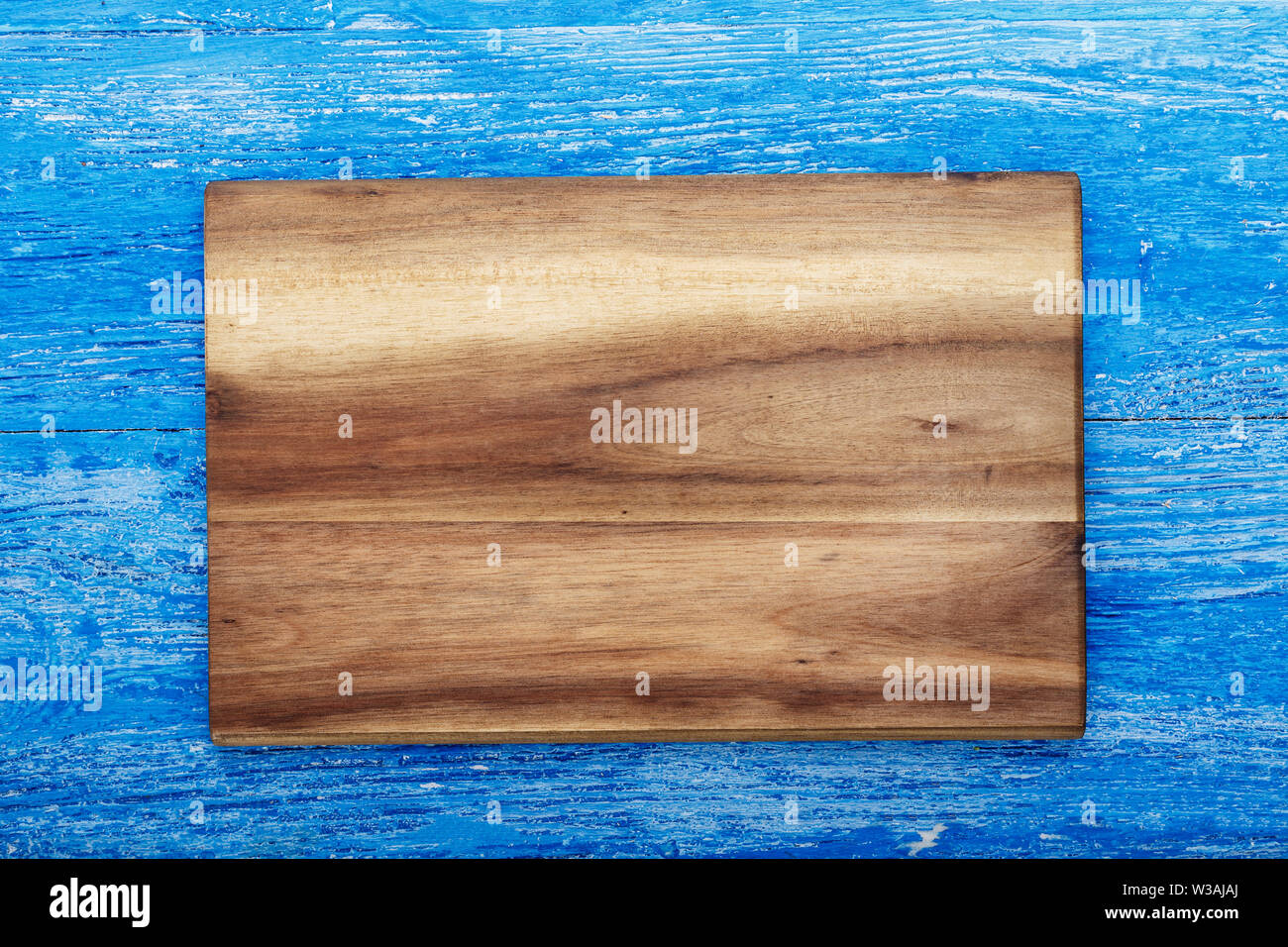Rectangular wooden cutting board made of light wood as a background ...