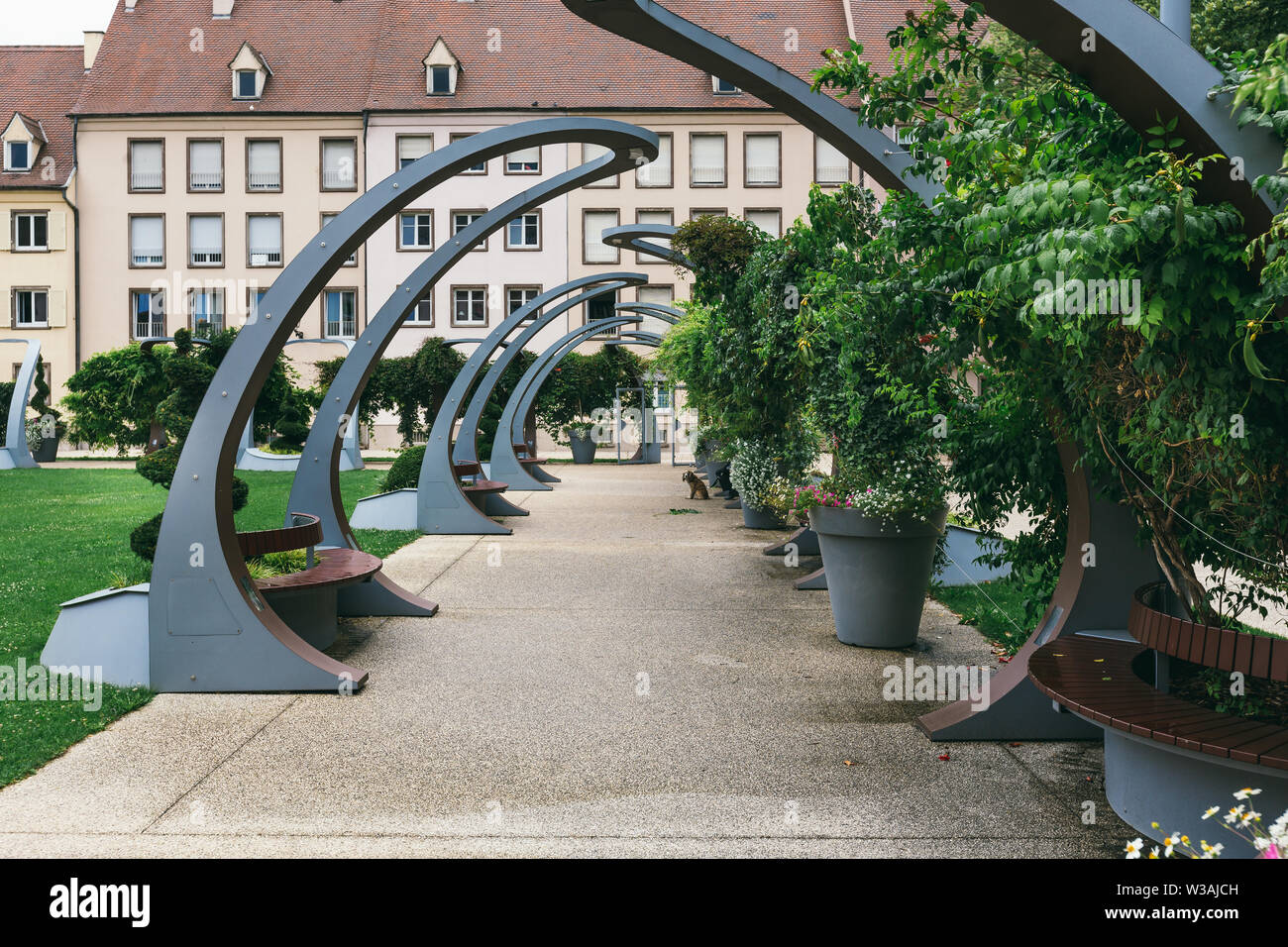 Colmar, France - July 26, 2017. Public park in front of the Building of ...
