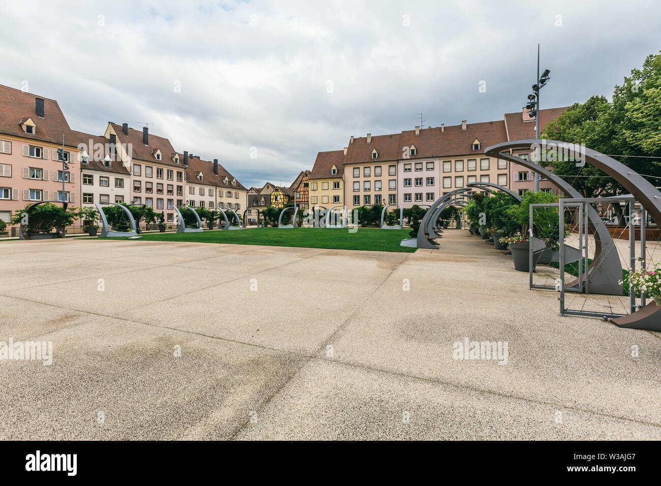 Colmar, France - July 26, 2017. Public park in front of the Building of ...
