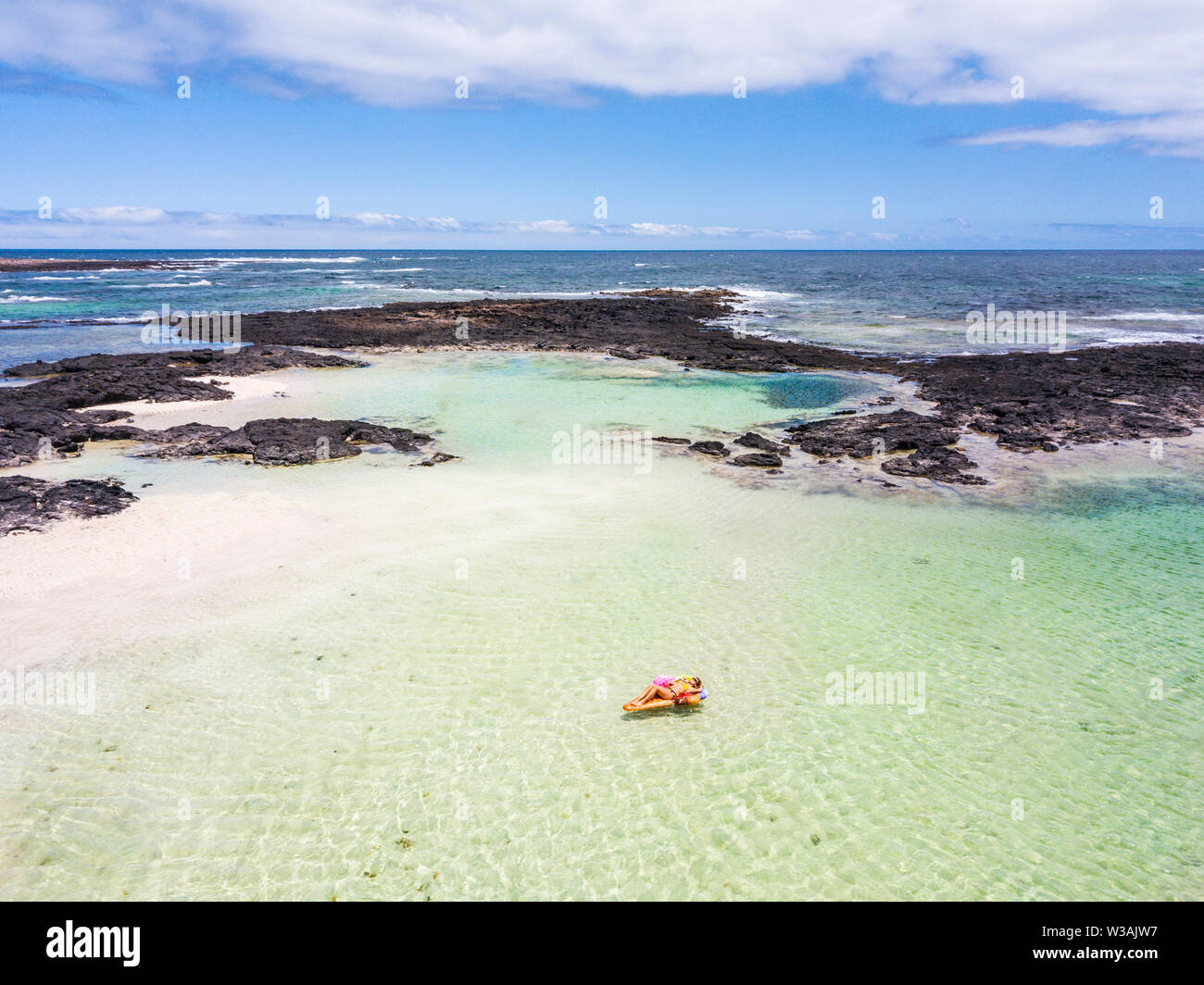 Woman lay down on beach and sunbath hi-res stock photography and images ...