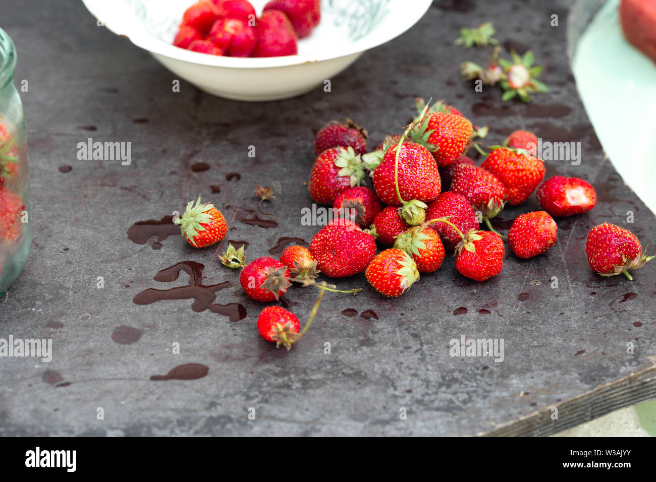 Homemade strawberries on table close up rustic style Stock Photo - Alamy