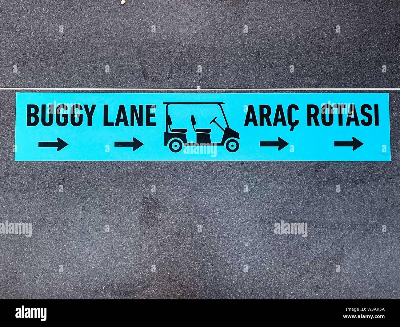 Buggy Lane with a symbol on the floor in English and Turkish language ...