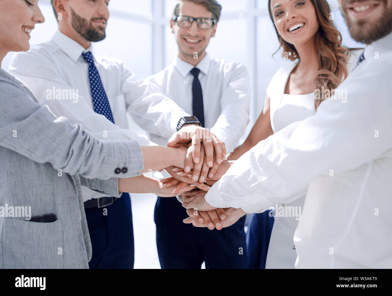 business team showing their unity Stock Photo - Alamy