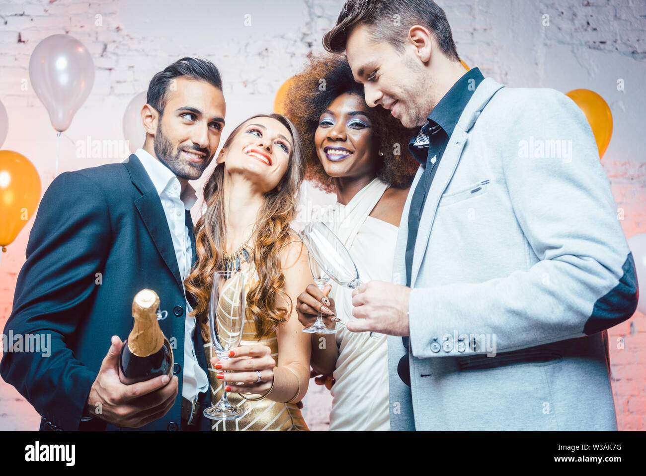 Couples in a club dancing into midnight Stock Photo - Alamy