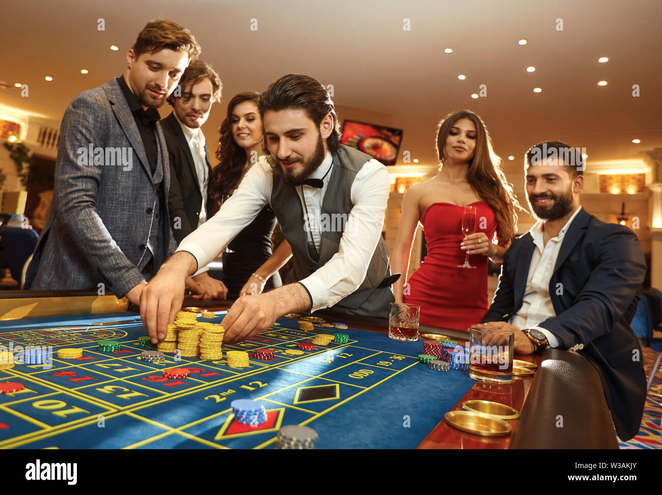Group of young people in casino hi-res stock photography and images - Alamy