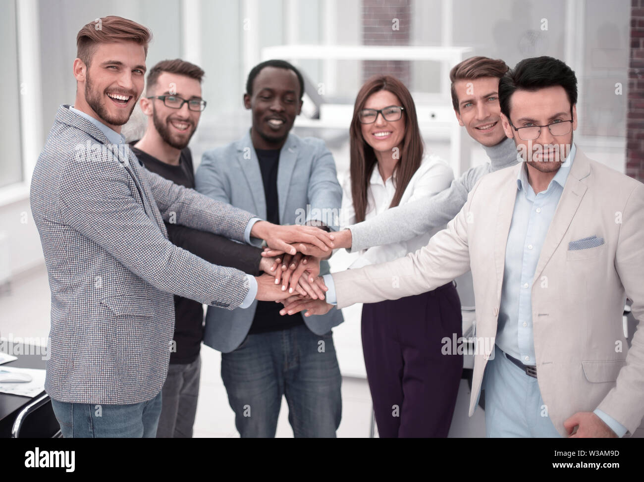 business team shows their unity Stock Photo - Alamy