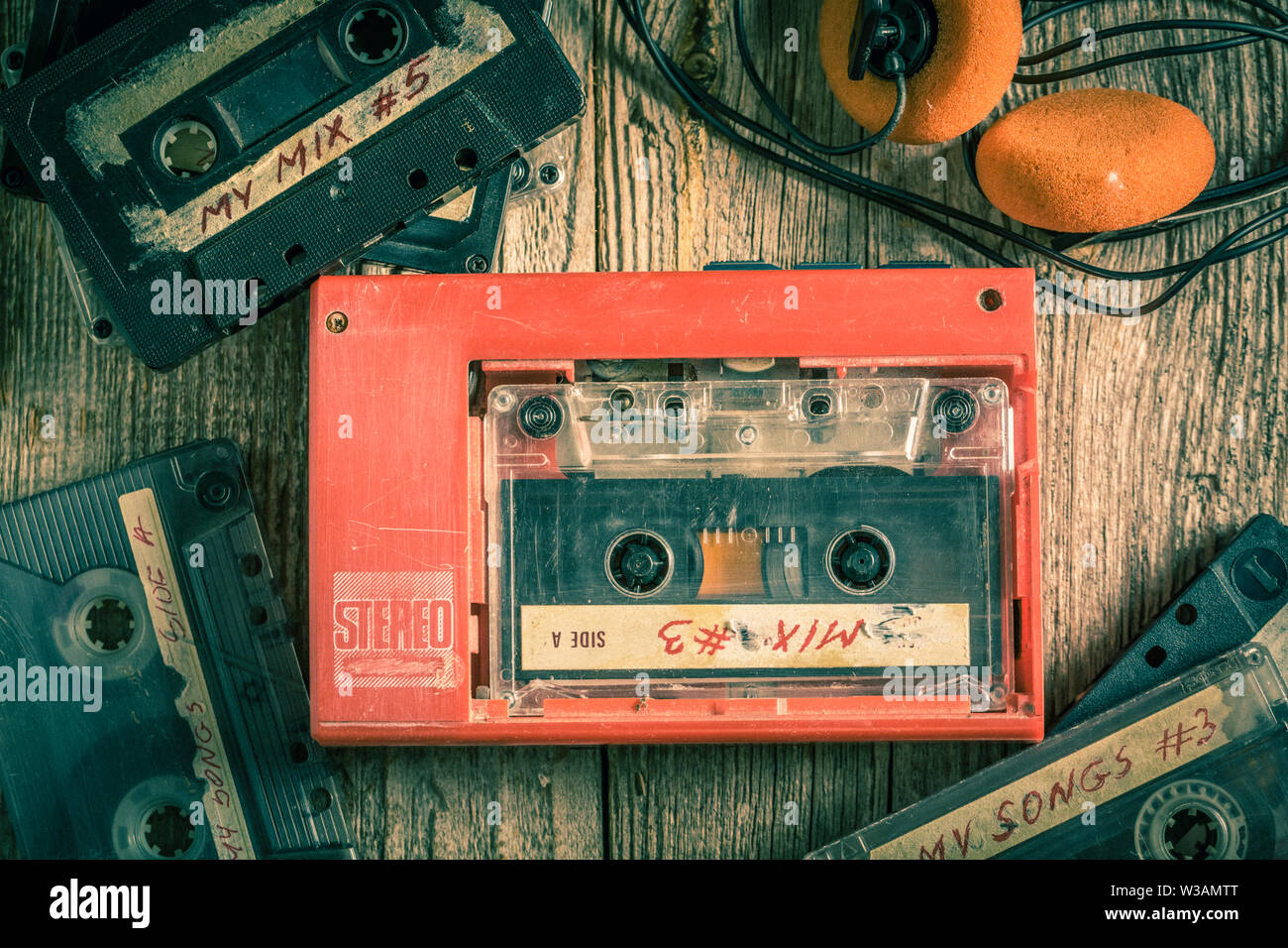 Vintage cassette tape with headphones and red walkman Stock Photo - Alamy