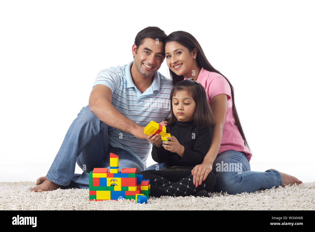Family sitting together Stock Photo - Alamy