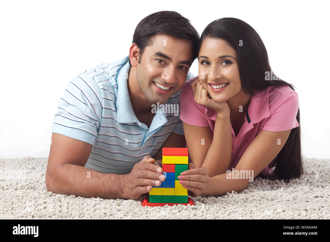 Couple playing with blocks Stock Photo - Alamy