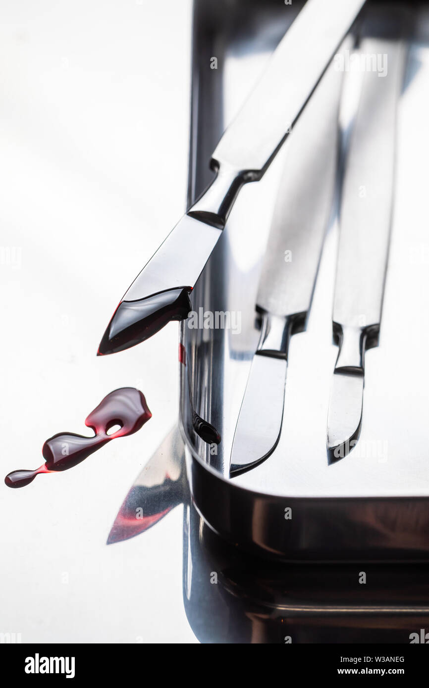 Closeup of scalpels on stainless steel table with red blood Stock Photo ...