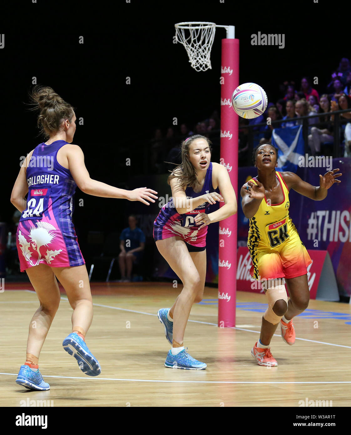Uganda's Stella Nafuka (right) and Scotland's Emma Barrie (centre ...