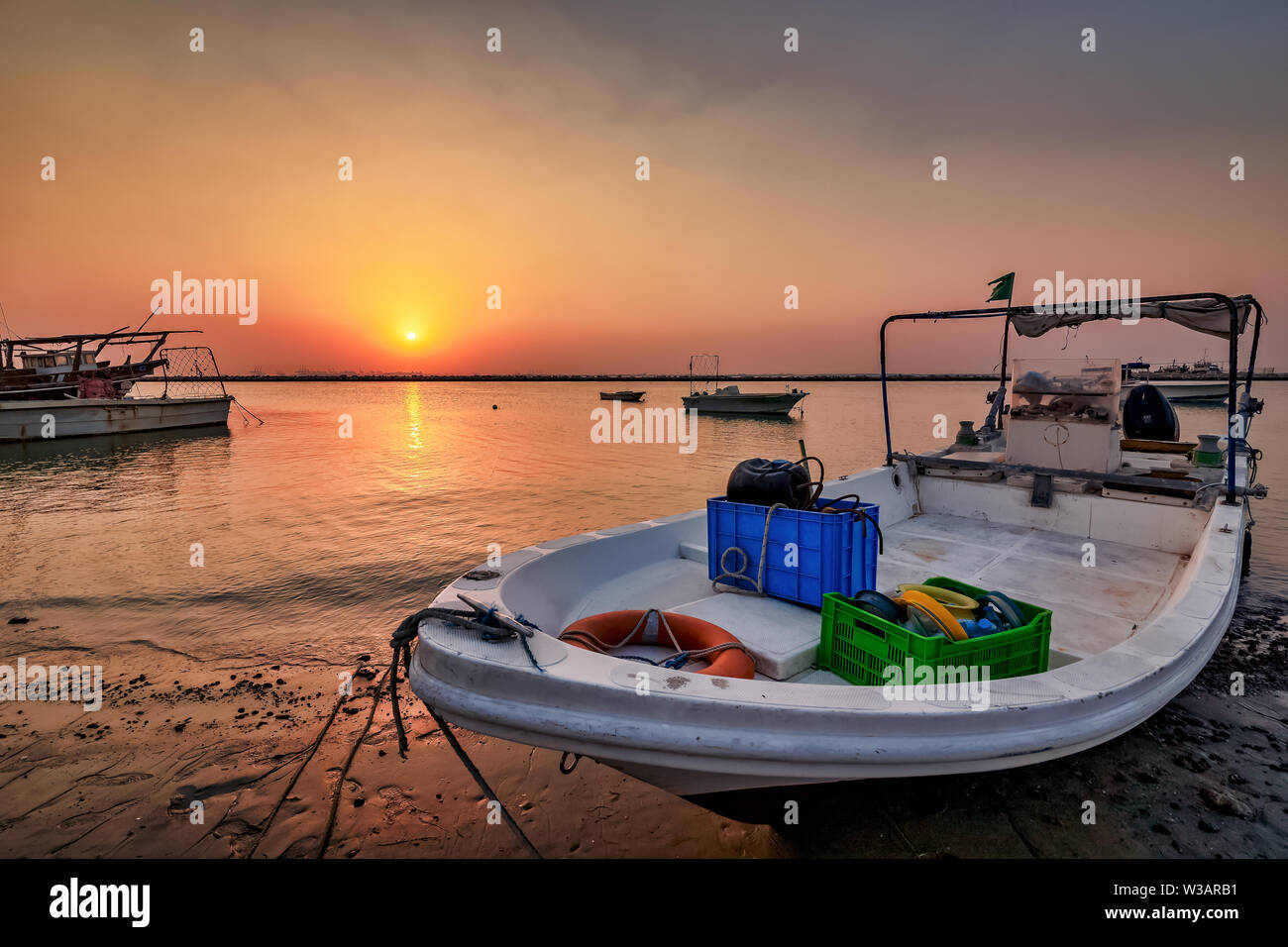Beautiful Sunrise Boat in seaside with yellow sky background. Dammam ...