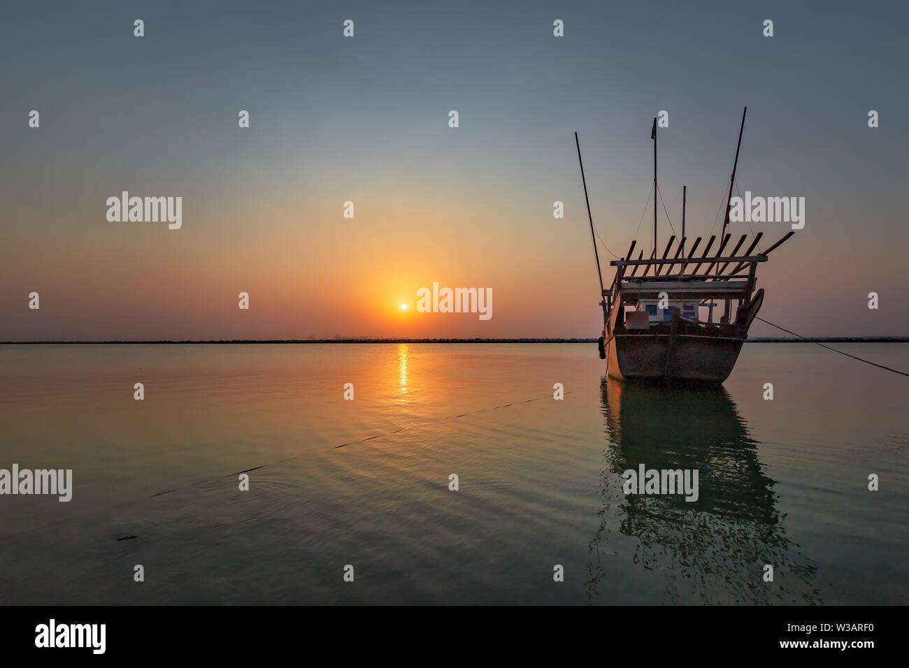 Beautiful Sunrise Boat in seaside with yellow and blue sky background ...