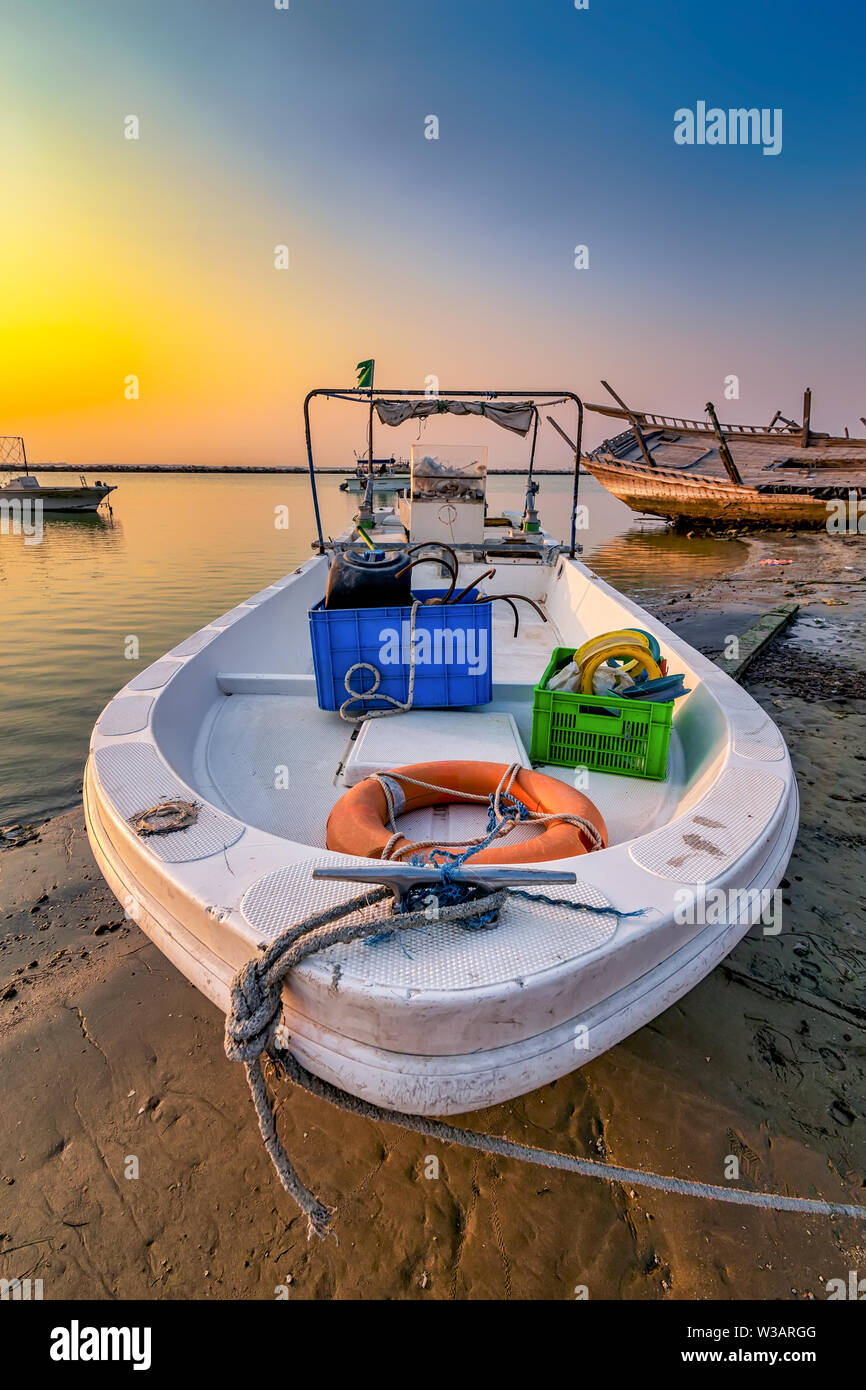 Beautiful Sunrise Boat in seaside with yellow and blue sky. Dammam ...