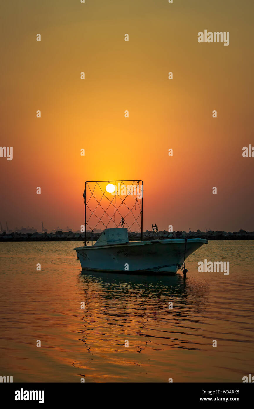 Beautiful Sunrise Boat in seaside with yellow sky. Dammam -Saudi Arabia ...