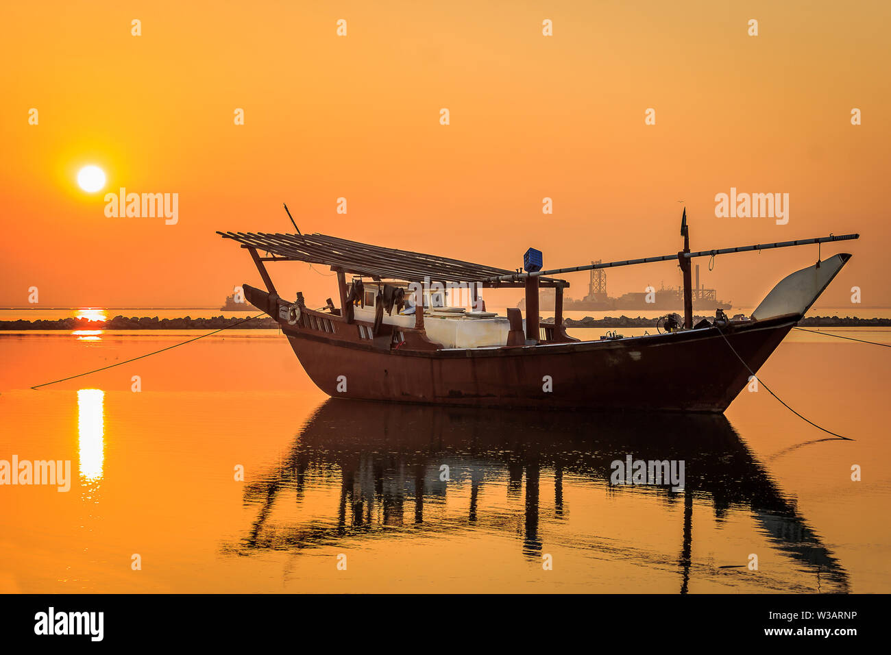Beautiful Sunrise Boat in seaside with yellow sky background. Dammam ...