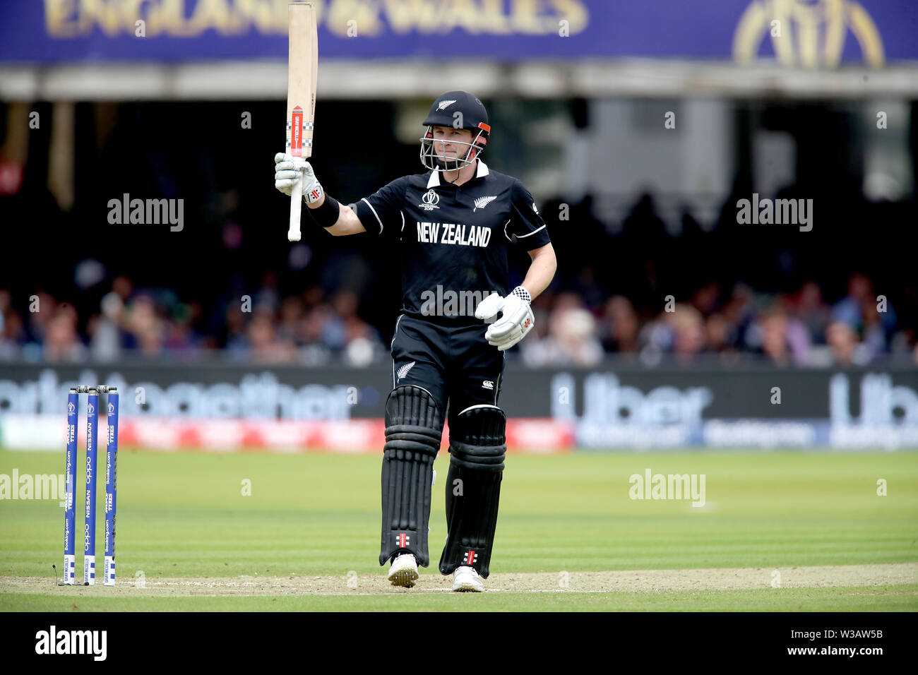 New Zealand's Henry Nicholls celebrates reaching fifty runs during the ...