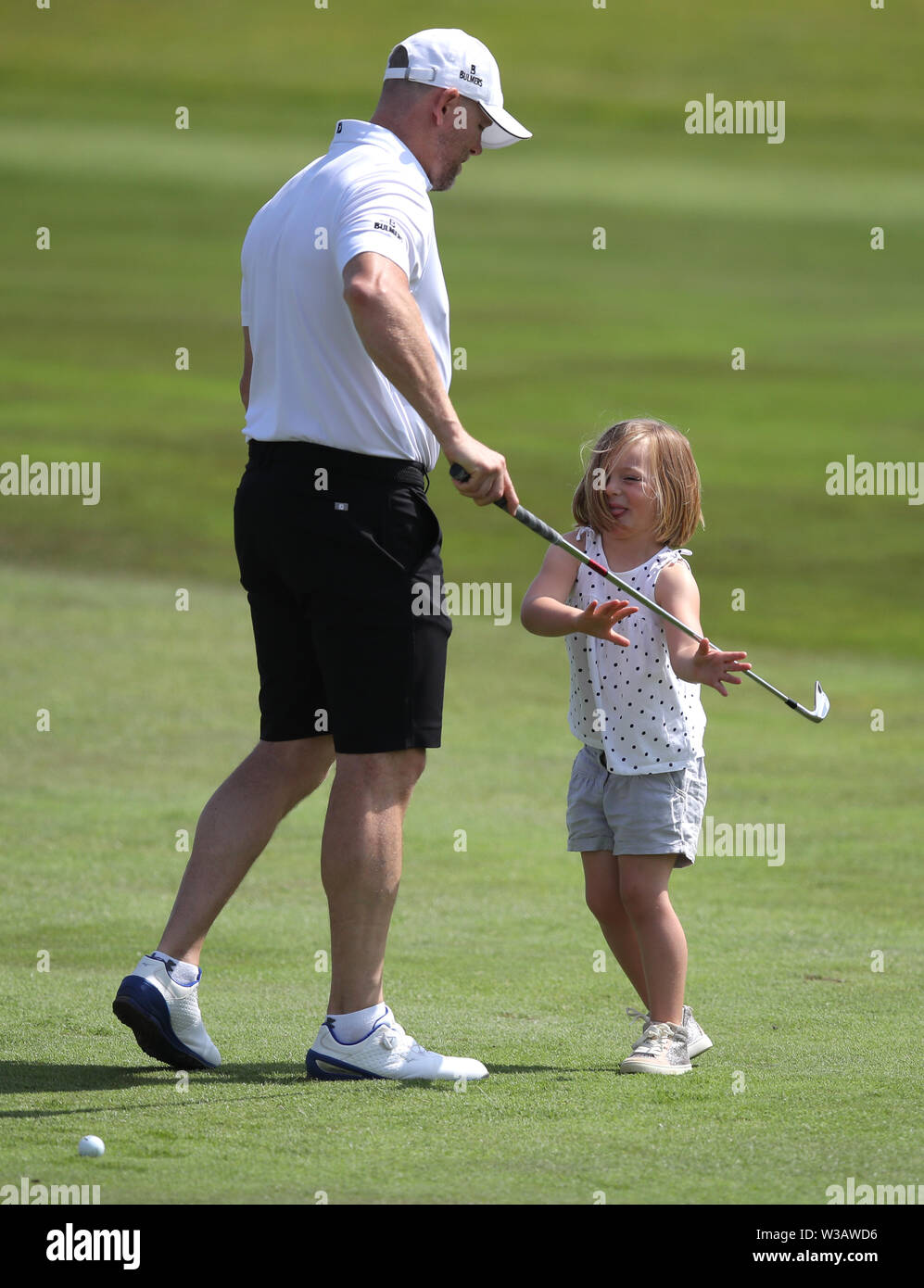 Mike Tindall (left) and his daughter Mia on the 4th fairway during the ...
