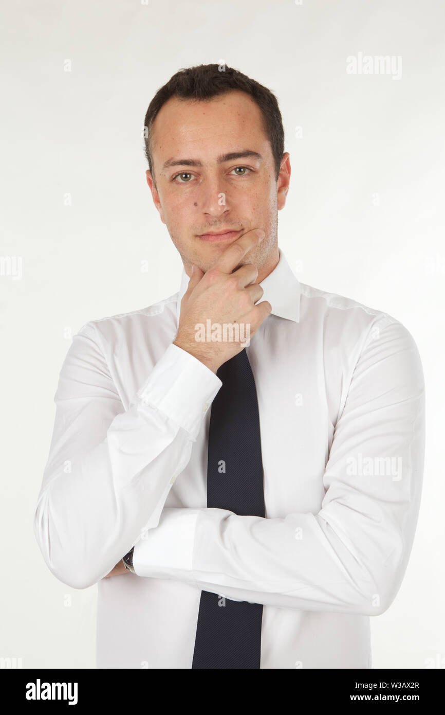 Portrait of a businessman thinking Stock Photo - Alamy