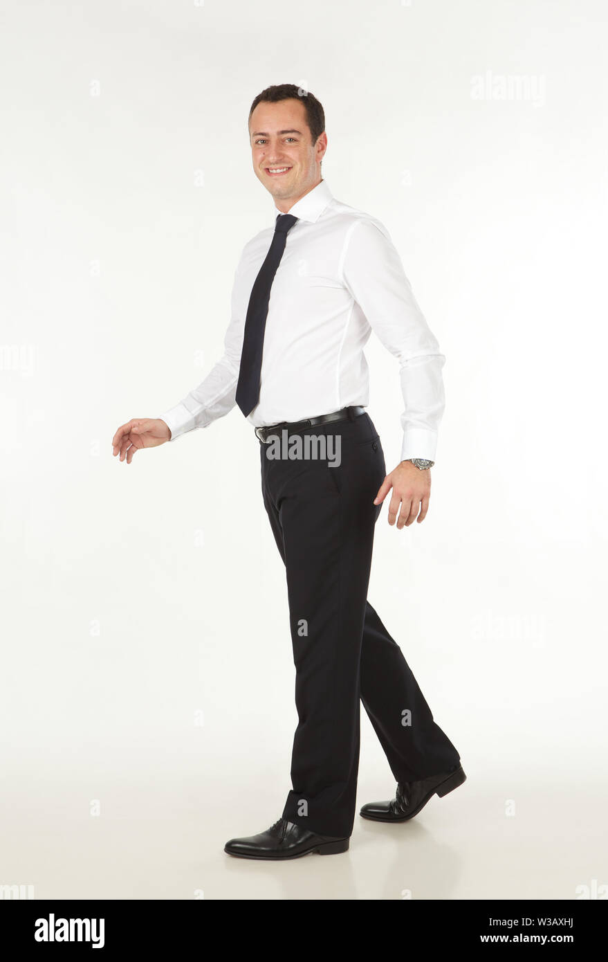 Portrait of a businessman walking Stock Photo - Alamy