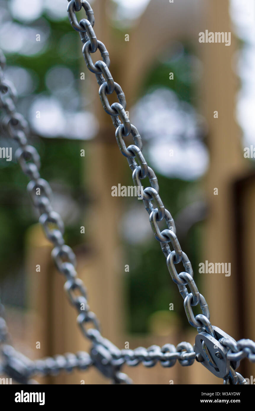 Diagonal chain with oval links on the background bokeh with blurred ...