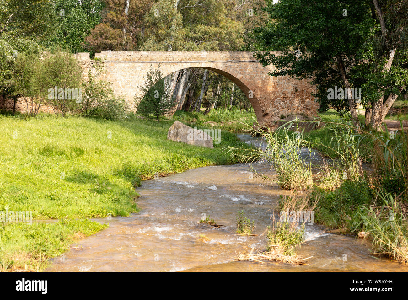 stone bridge over the river on the water route of Chelva, Valencia ...