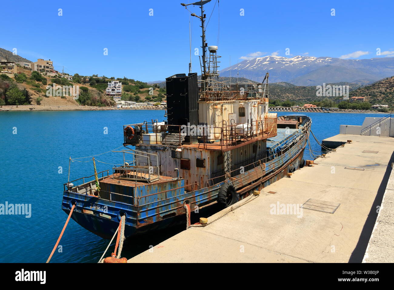 The rusty wreck of two vessels in agia Galini in Crete in Greece Stock ...