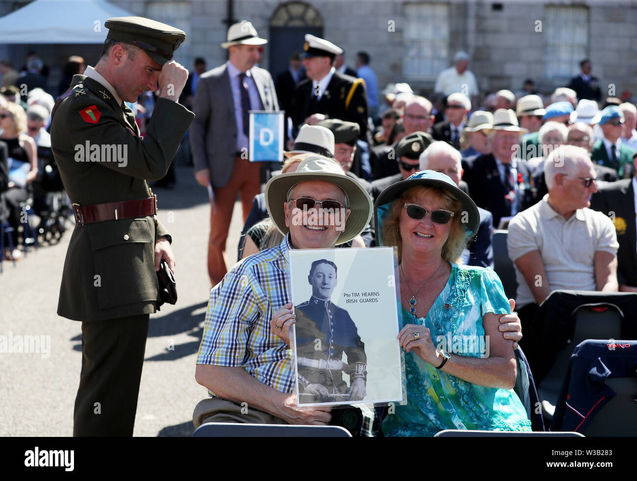Emer McCarthy and her husband Chris, from Gorey, hold a photo of her ...