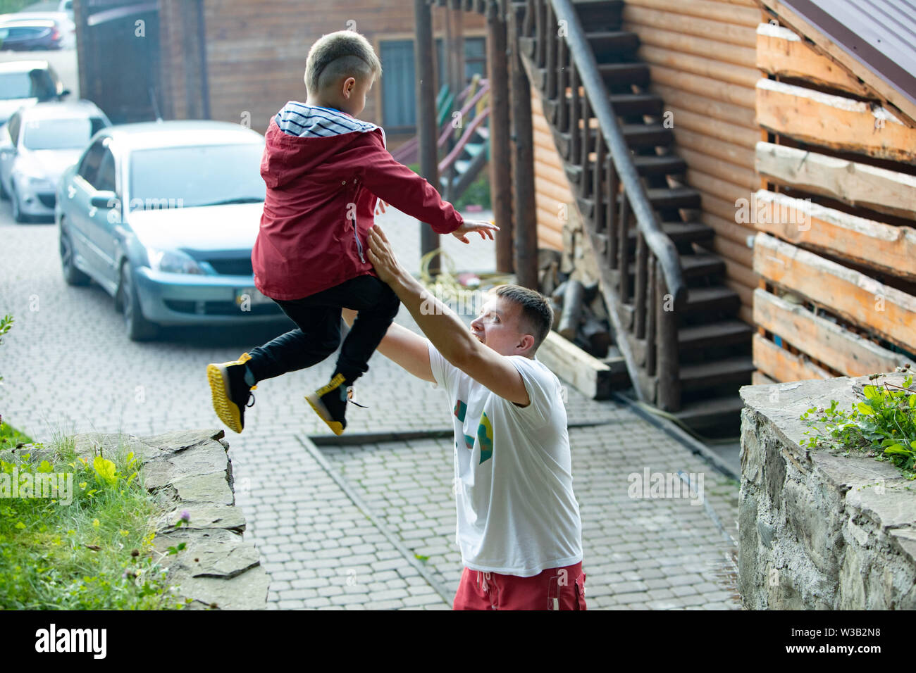 Man throwing child air catching hi-res stock photography and images - Alamy