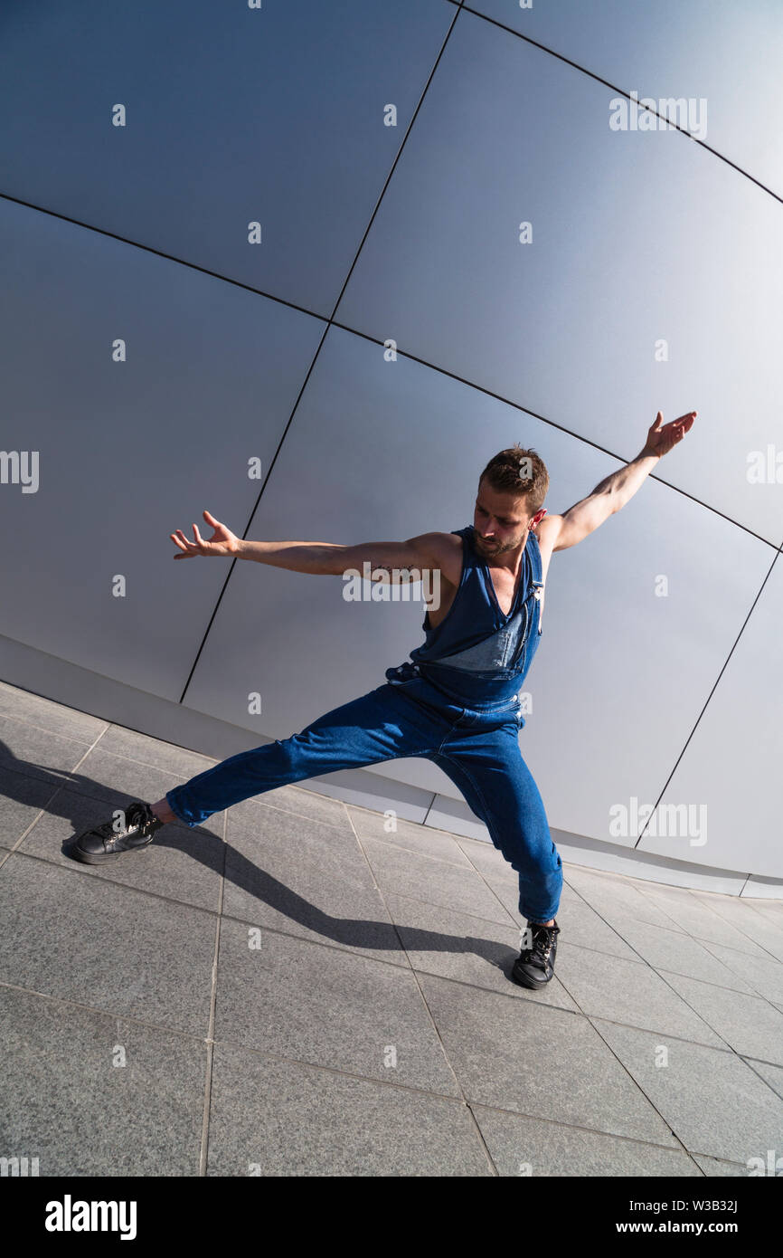 Young handsome man street dancer dancing outdoor Stock Photo - Alamy