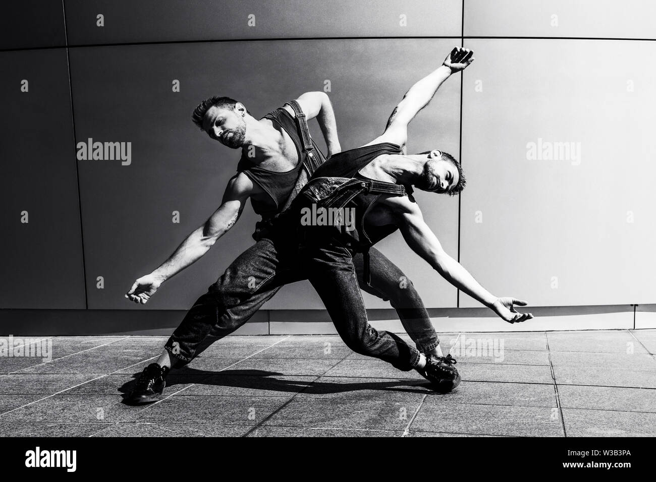Dancer dancing modern dance with his ghost double Stock Photo - Alamy