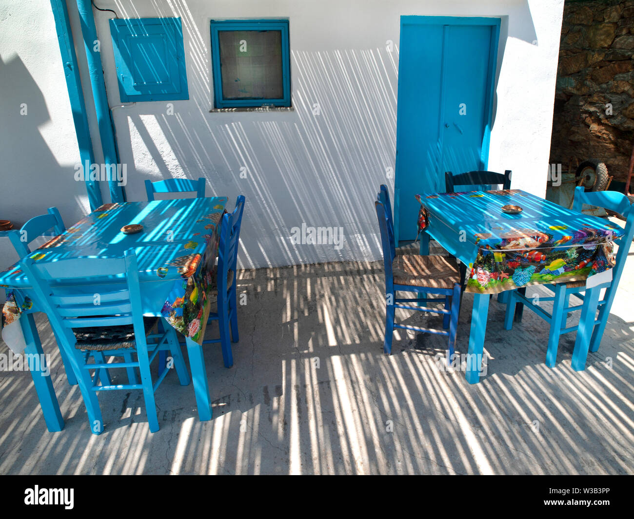 Outside greek restaurant table beach hi-res stock photography and ...